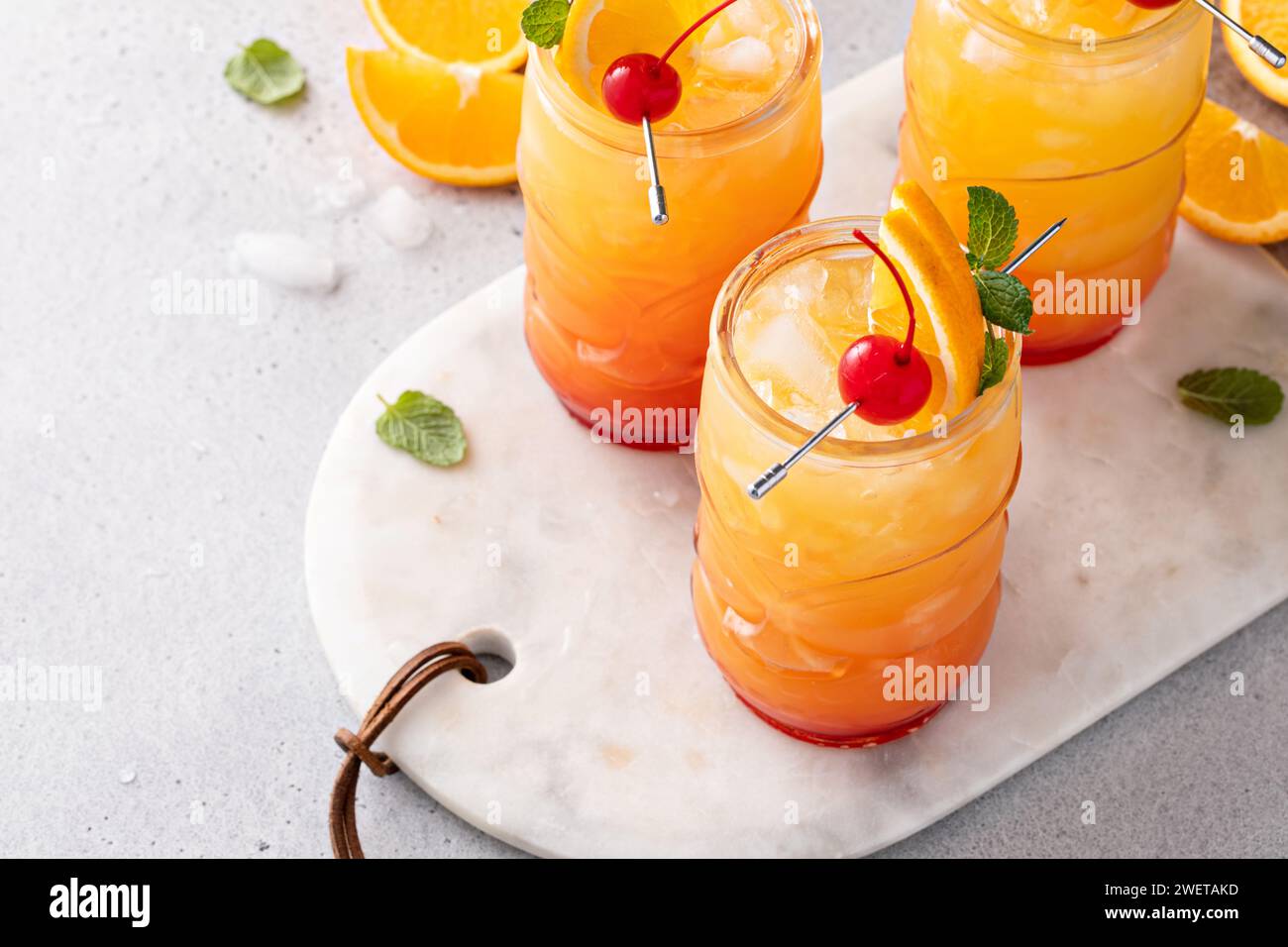 Hurricane cocktail in tiki glasses, tropical, rum-based cocktail with ...