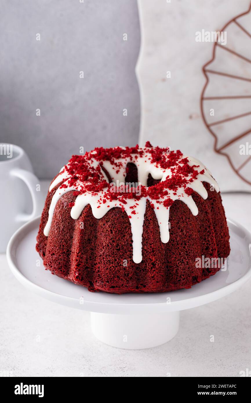 Red velvet cake with cream cheese glaze and red velvet crumbs on top ...