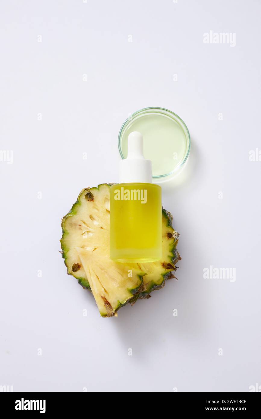 Mockup scene for serum, cosmetic of pineapple extract with glass bottle ...