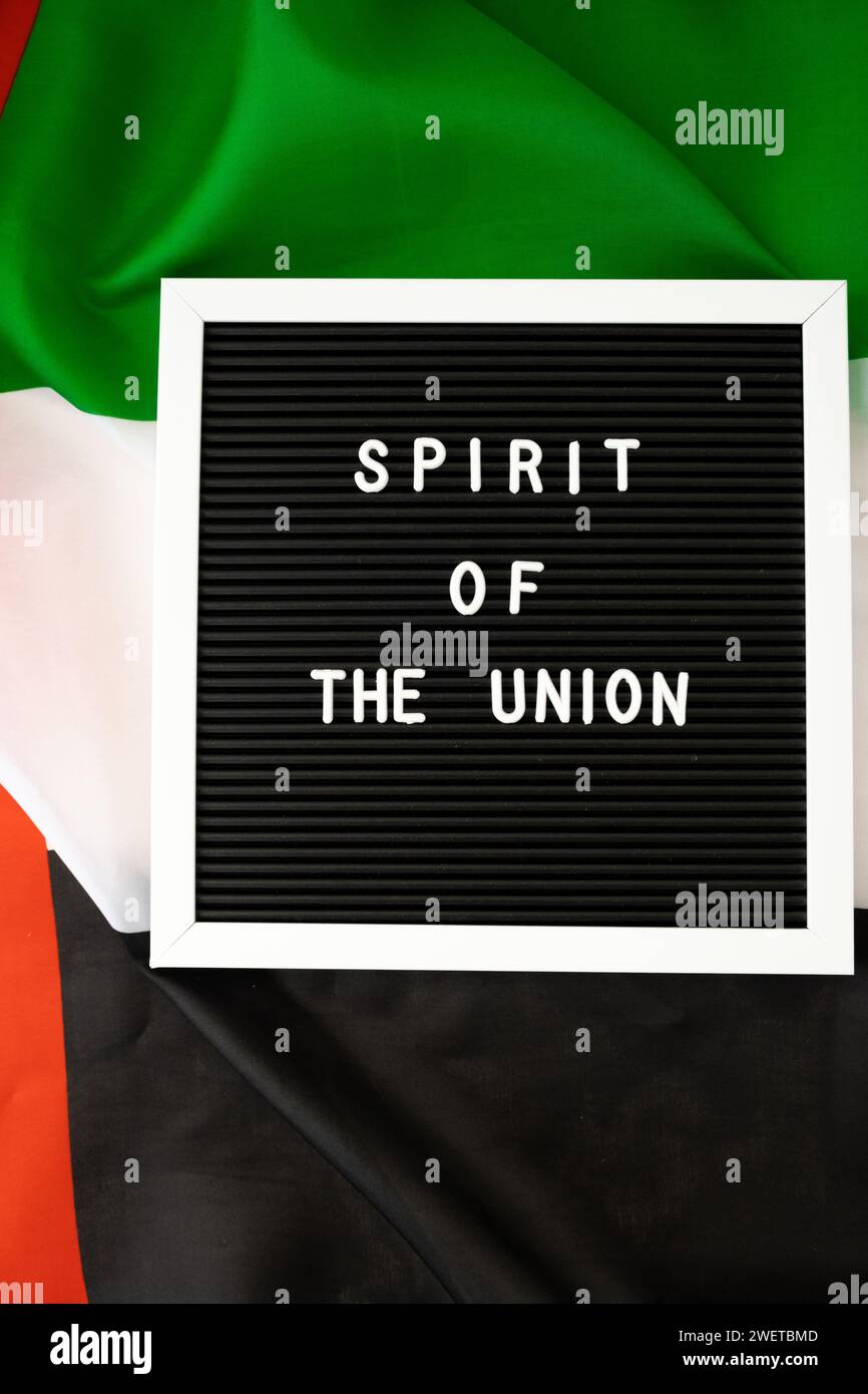 Text SPIRIT OF THE UNION on background flag of UAE. National holiday of ...