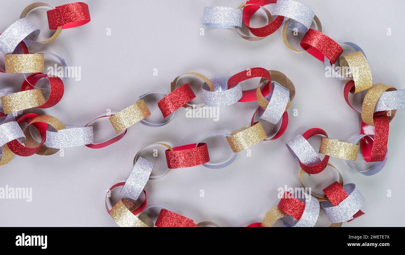 Colorful background with strips of gold silver red sparkling chain ...