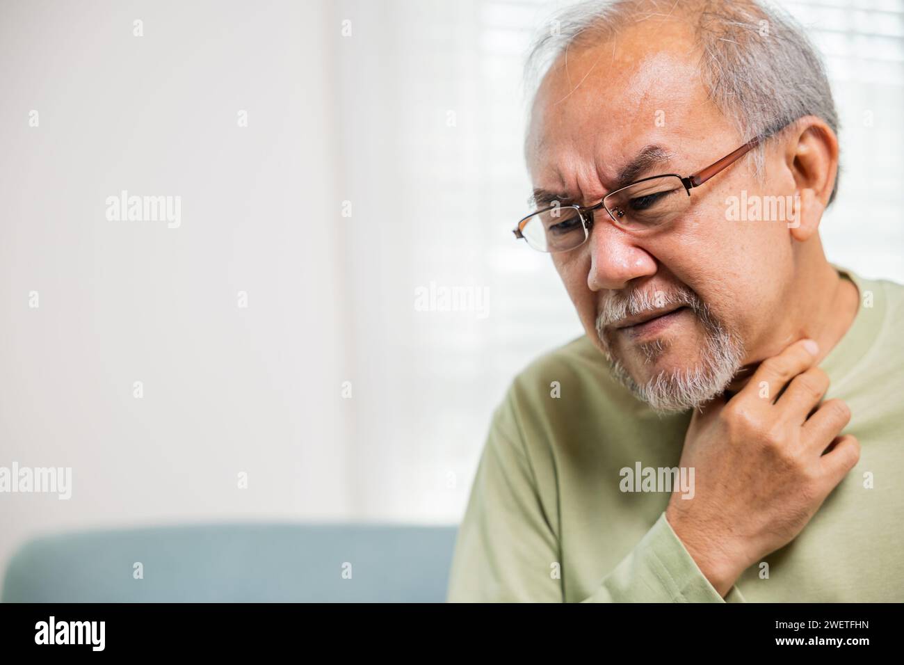 Retirement senior man feeling pain use hands holding neck and ...