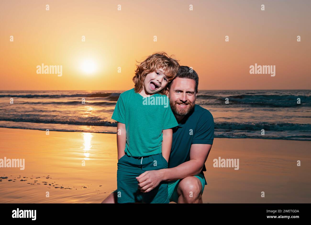 Father hugging son on beach hi-res stock photography and images - Alamy