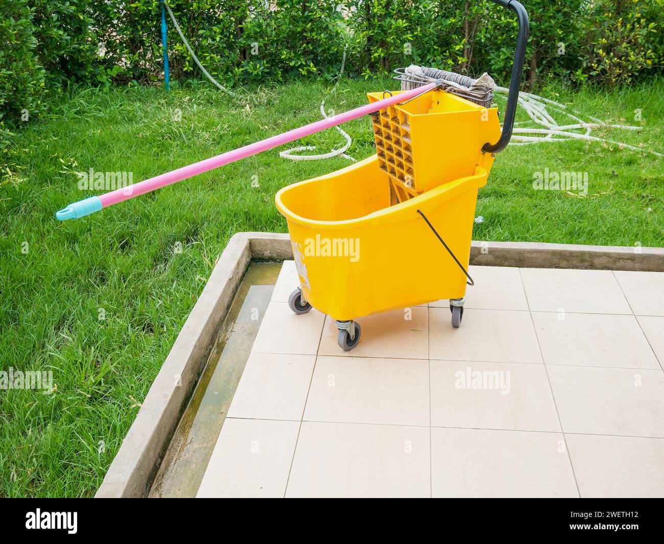 mop bucket on the floor Stock Photo - Alamy