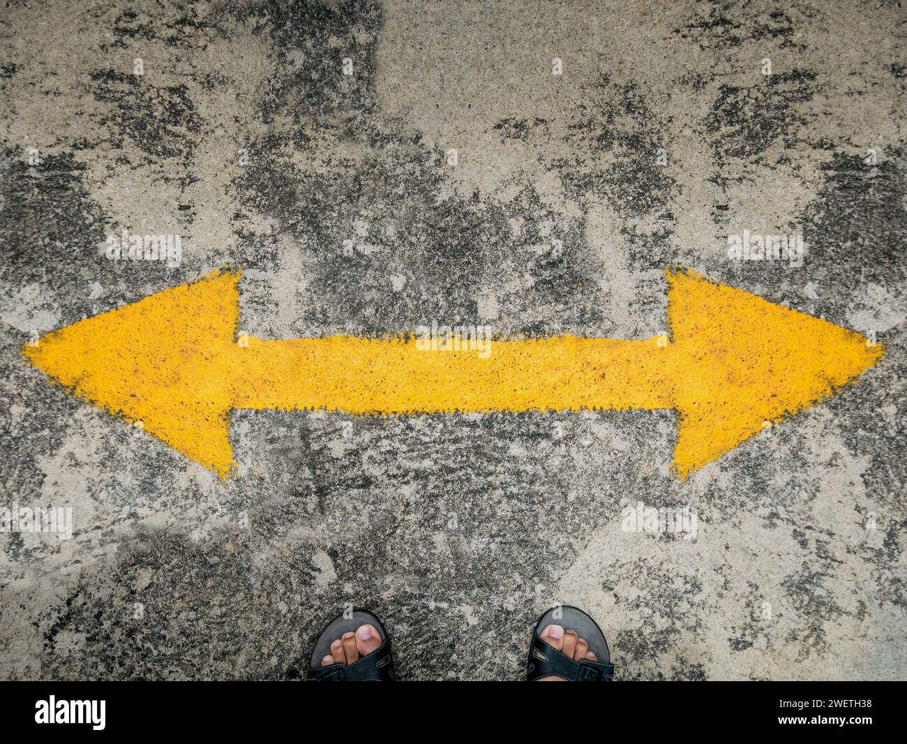 Yellow road sign two arrows hi-res stock photography and images - Alamy