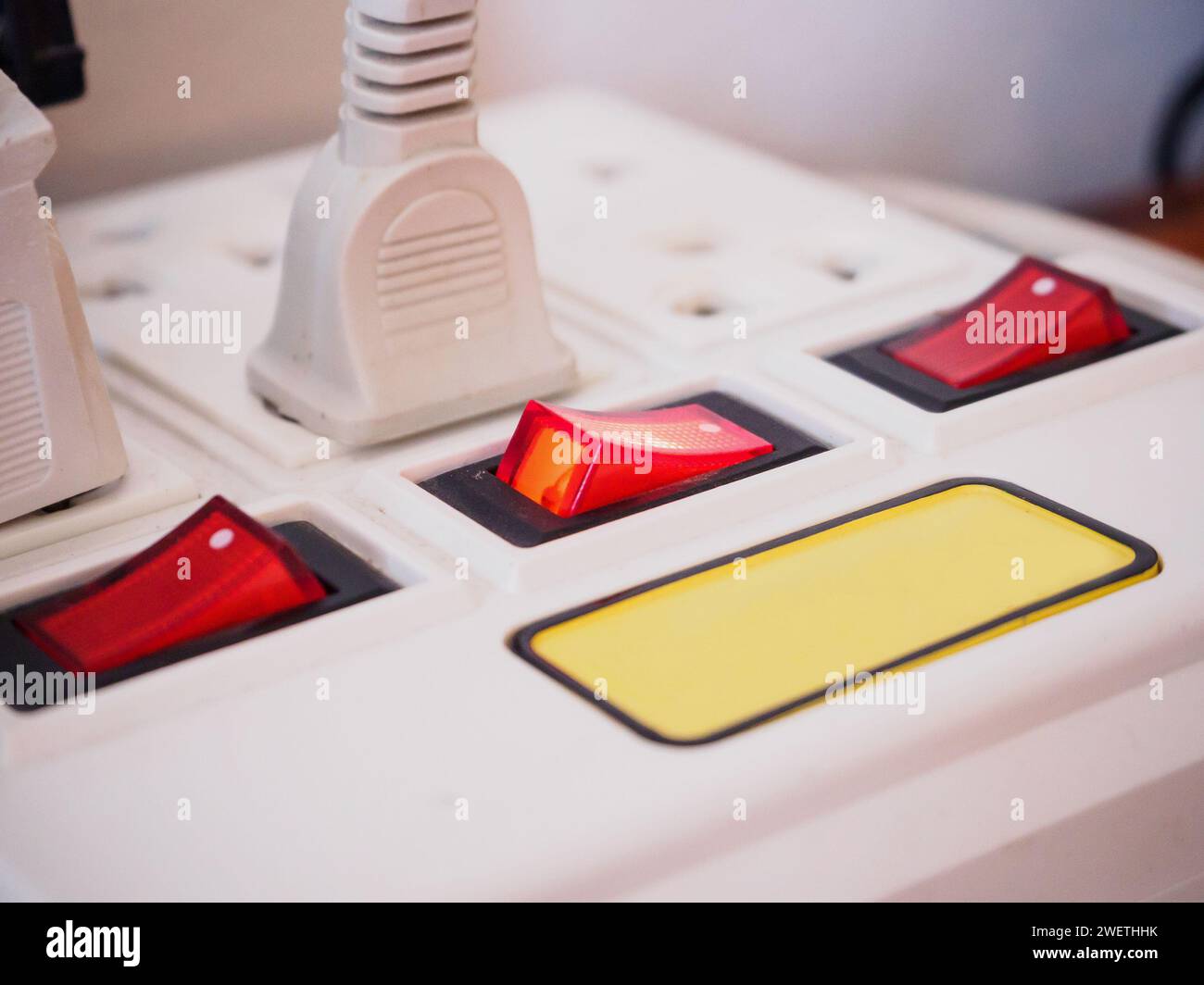 Multiple power socket with connected plugs Stock Photo - Alamy