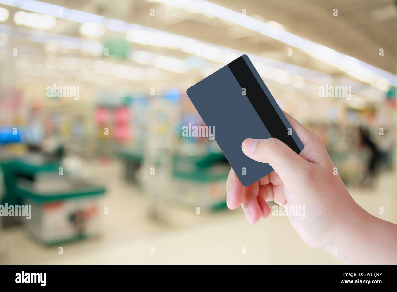 Buying with Credit Card in supermarket Stock Photo - Alamy