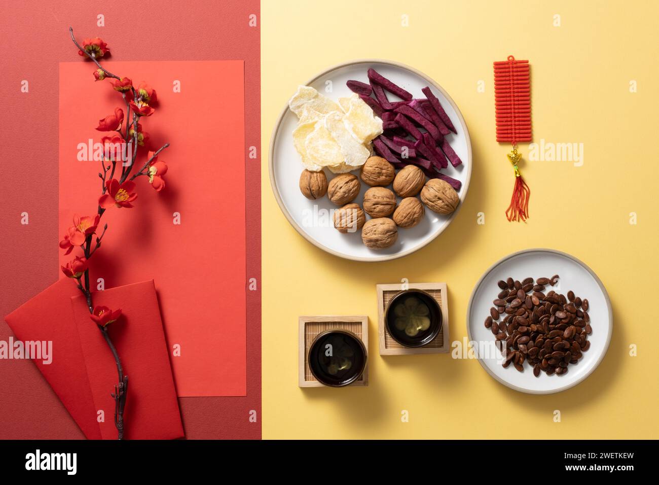 Traditional lunar new year food with melon seeds, walnuts, and jams on ...