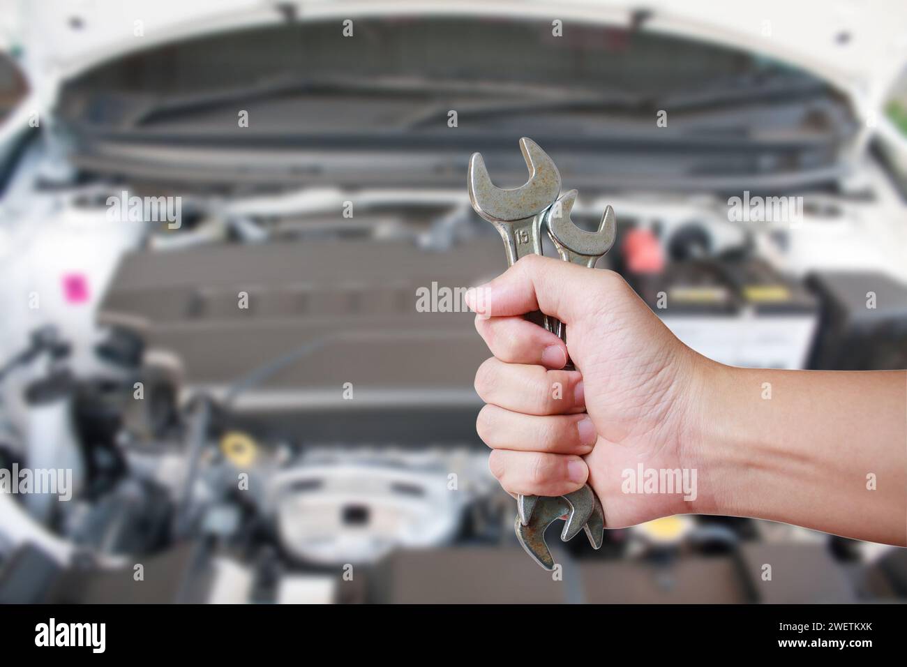 Mechanic Holding Spanner Fixing Car Engine Stock Photo - Alamy