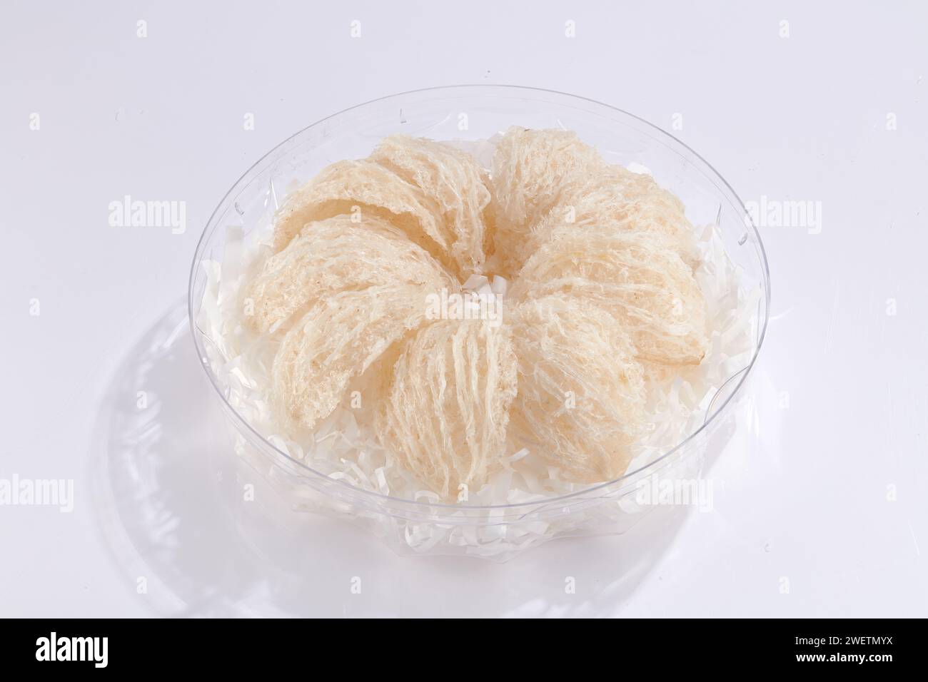 Close-up of raw bird's nests neatly arranged on transparent plastic ...