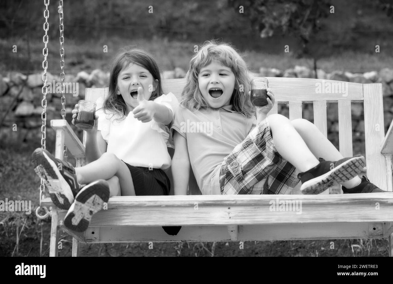 Two excited amazed children outdoors. Portrait of adorable brother and ...