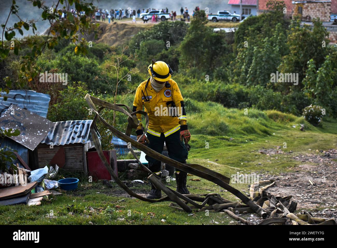 Bogota, Colombia. 25th Jan, 2024. Firefighters work to extinguish the ...