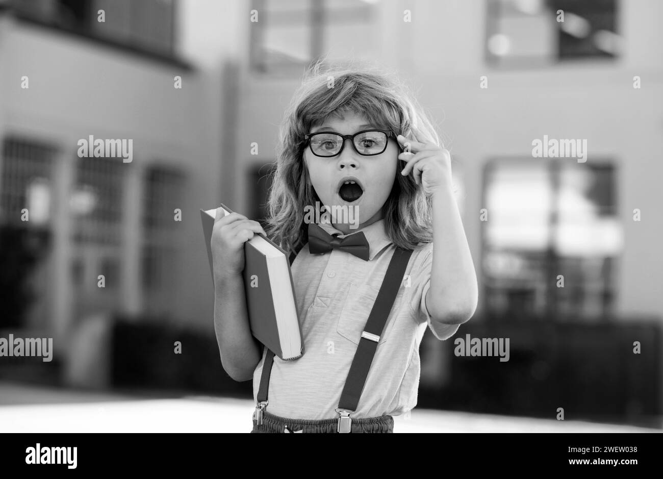 Happy excited kid in glasses is going to school for the first time ...