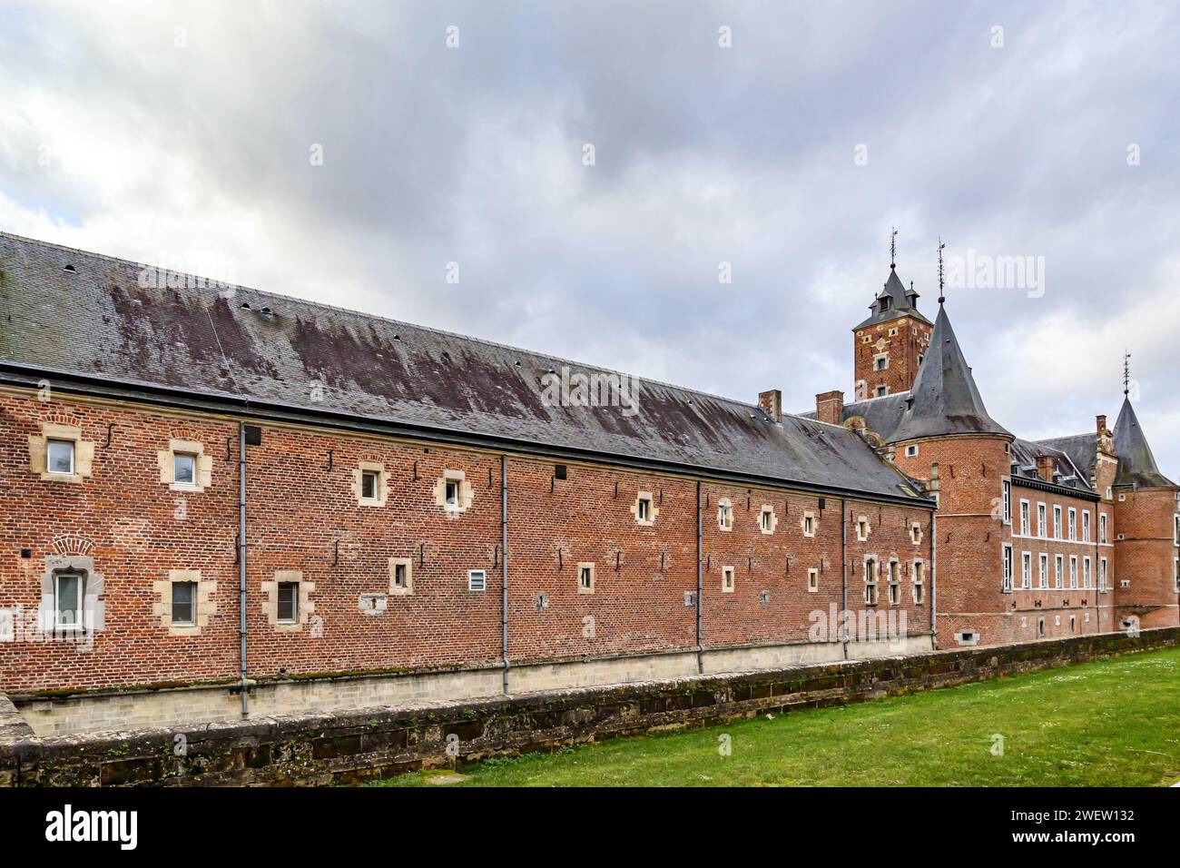 Side part of 16th century Alden Biesen castle, small windows, brick ...