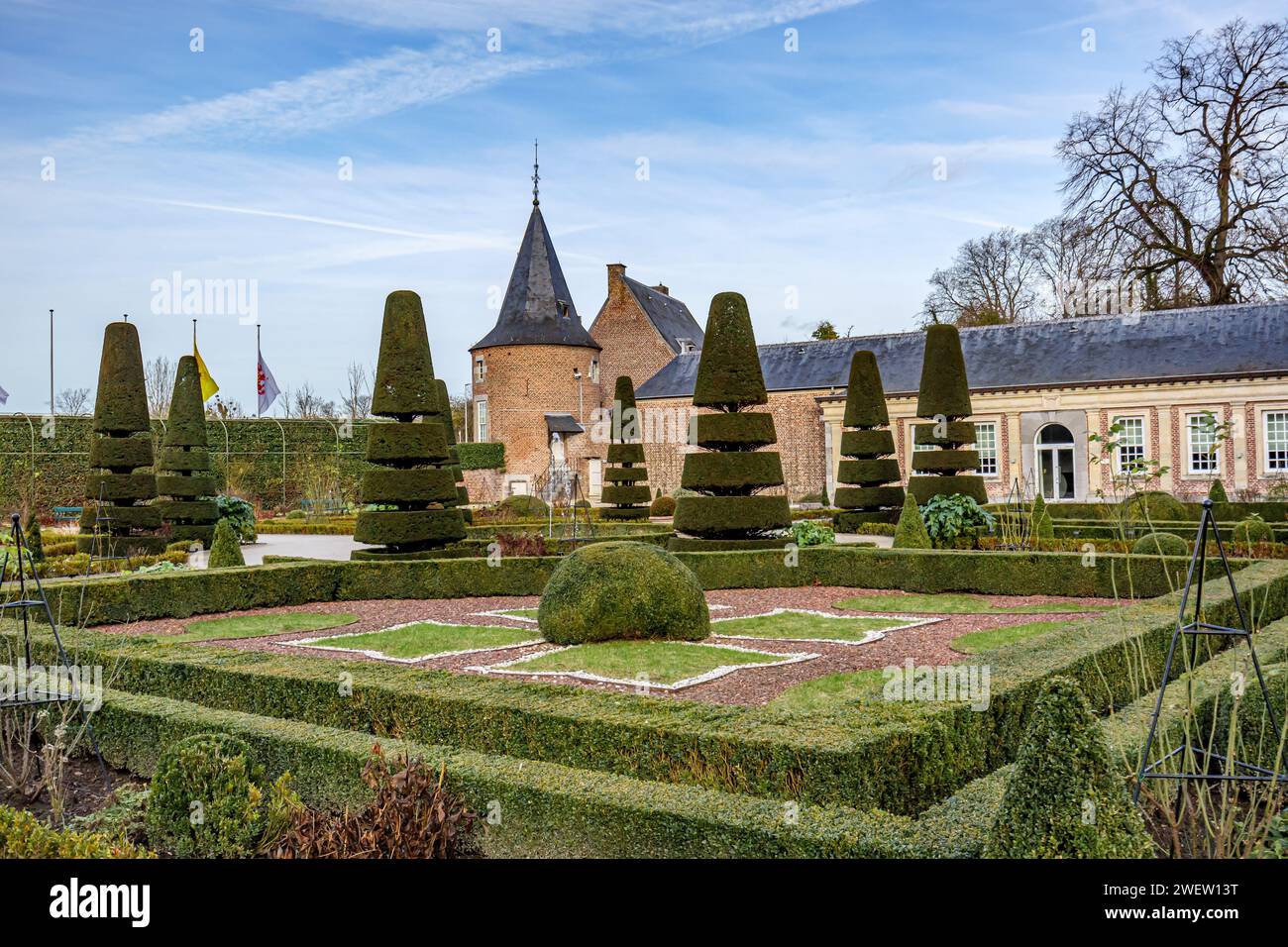 French garden with shrubs and trees cut into conical shape at Alden ...