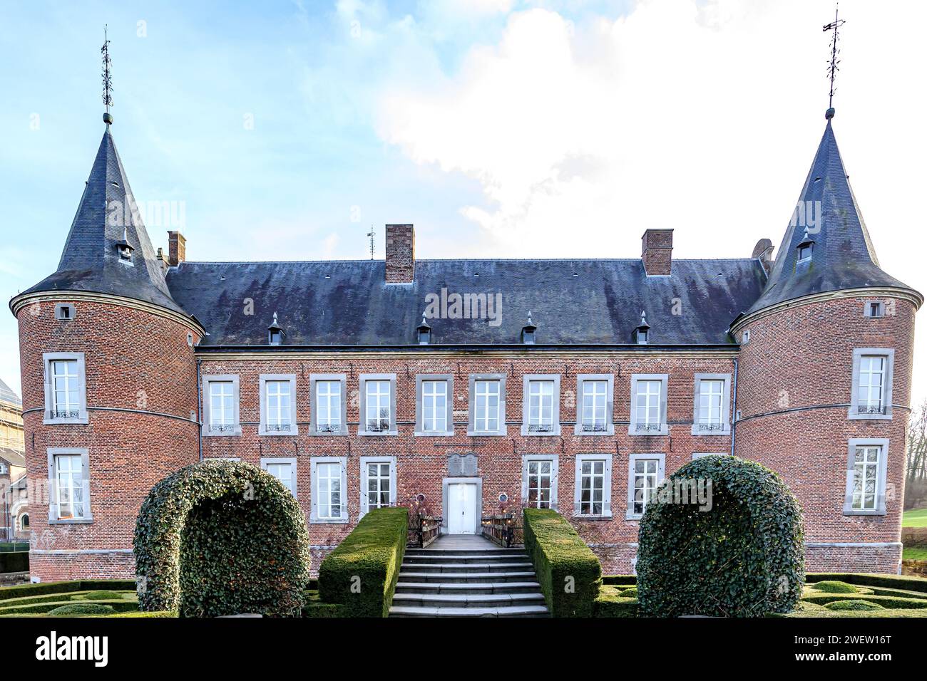 Main facade of 16th century Alden Biesen castle, circular towers ...