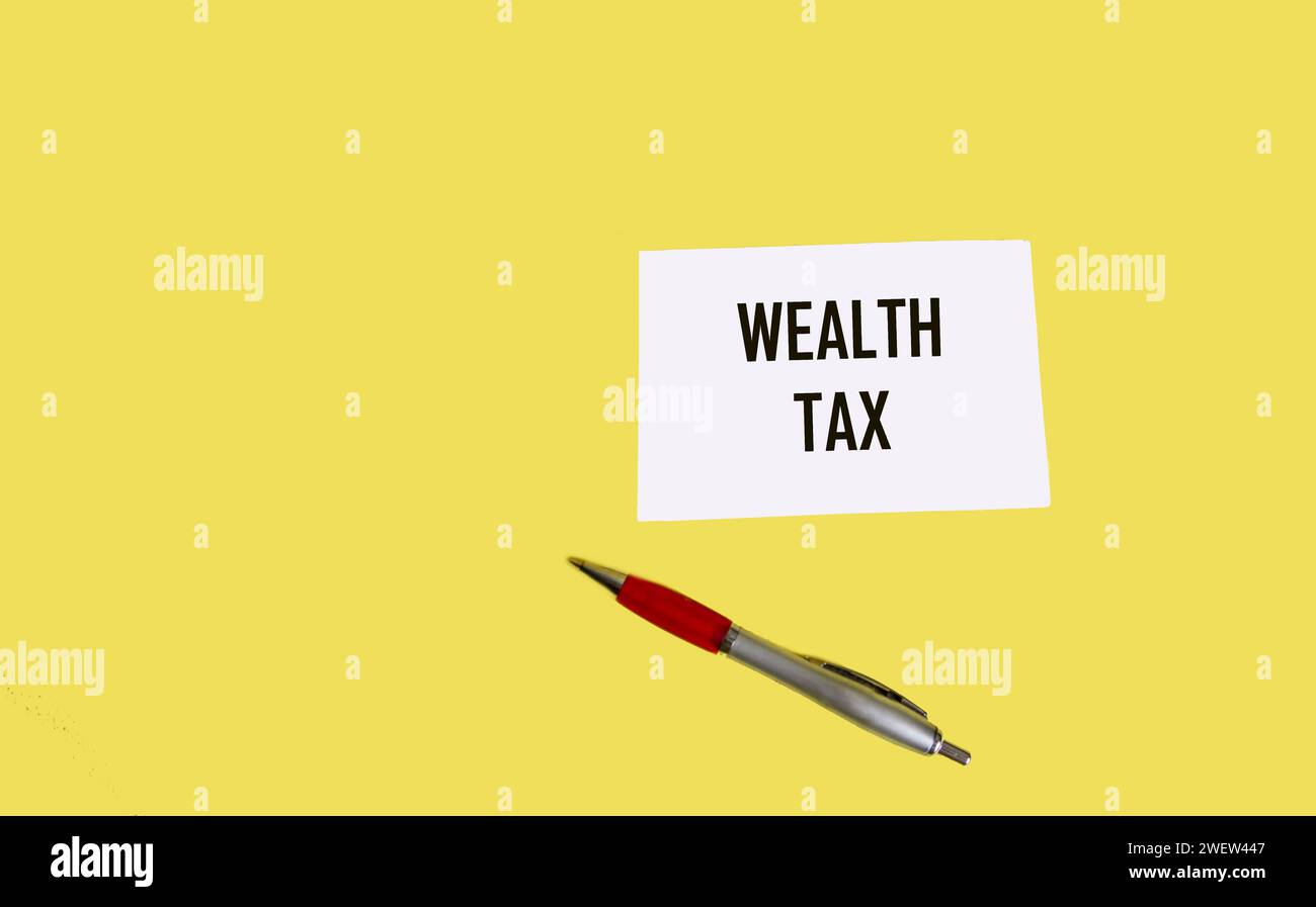 Text BIG TAX on a notepad and yellow background. Business concept Stock ...