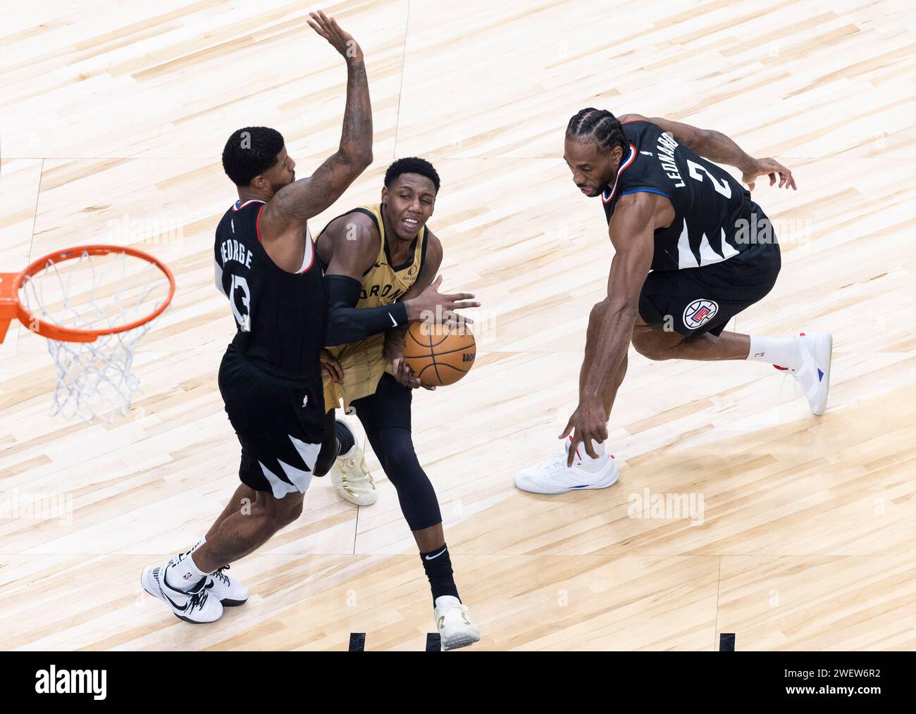 Toronto, Canada. 26th Jan, 2024. RJ Barrett (C) of Toronto Raptors breaks through during the ...
