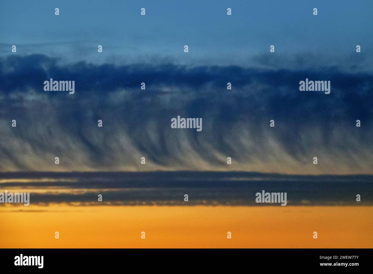 Unusual clouds in the post-sunset hour, like clouds of long straight ...