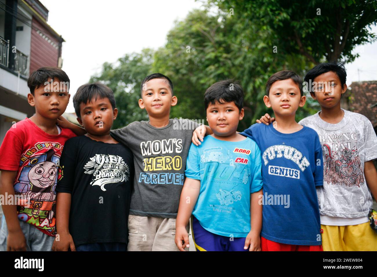 Portrait of asian group children arm in arm Stock Photo - Alamy