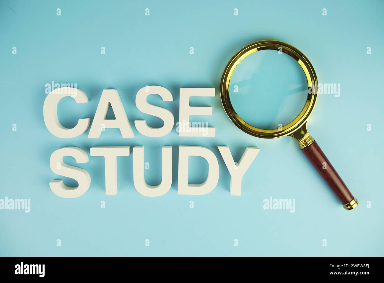 Case Study alphabet letters with magnifying glass on blue background ...