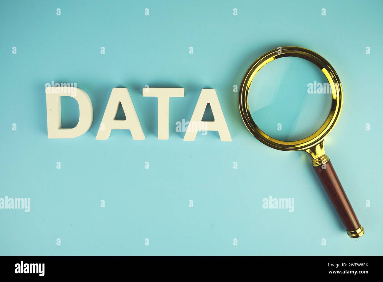 Data alphabet letters with magnifying glass on blue background Stock ...