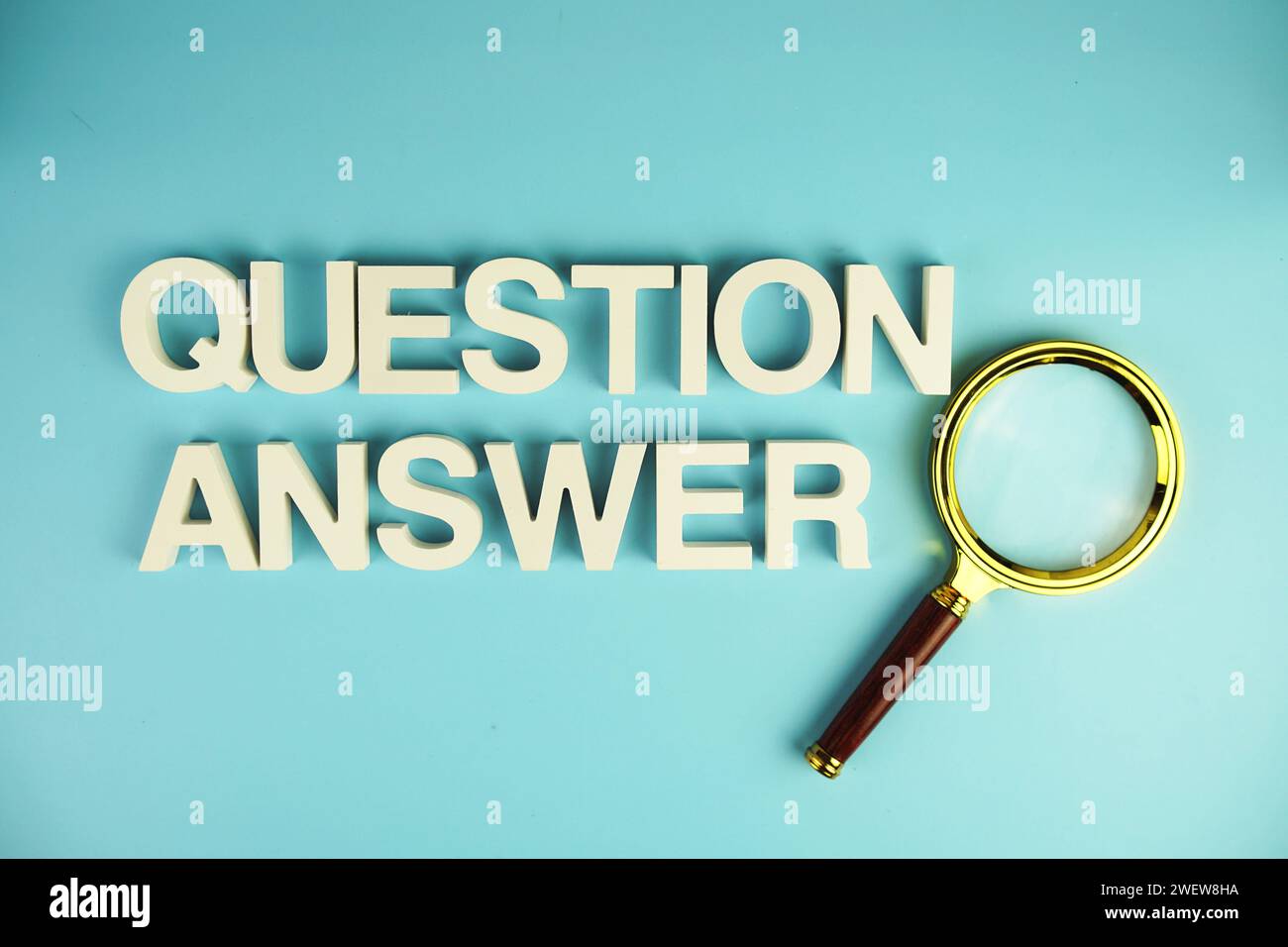 Question and Answer alphabet letters with magnifying glass on blue ...