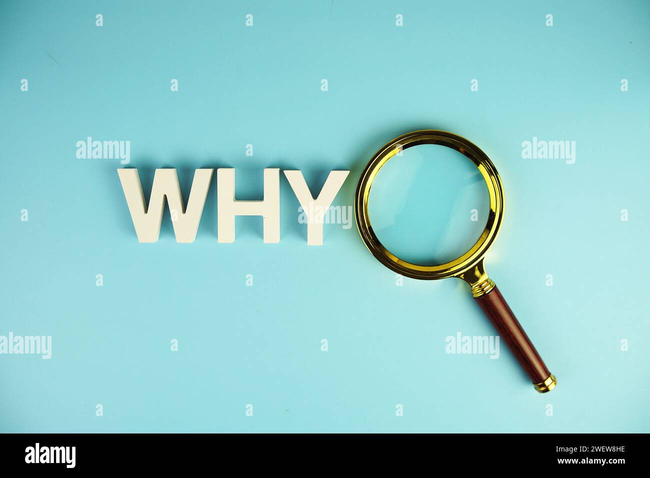 WHY alphabet letters with magnifying glass on blue background Stock ...