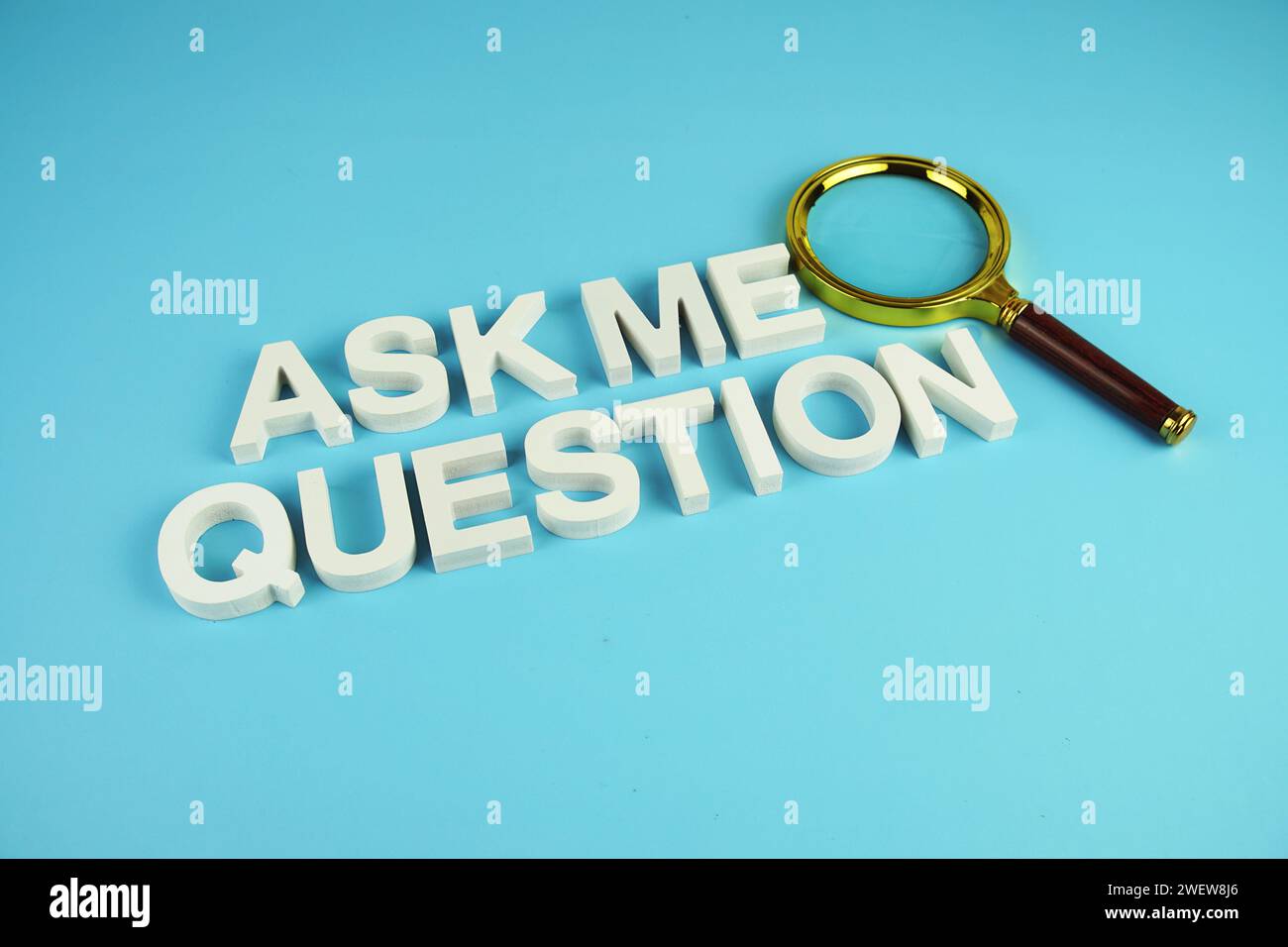 Ask me question alphabet letters with magnifying glass on blue ...
