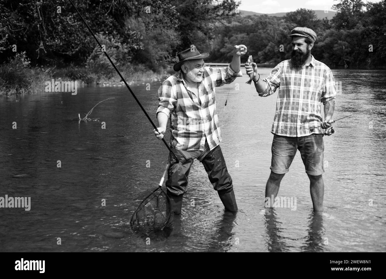 Fisherman men friends and trophy trout. Father and son fishing ...