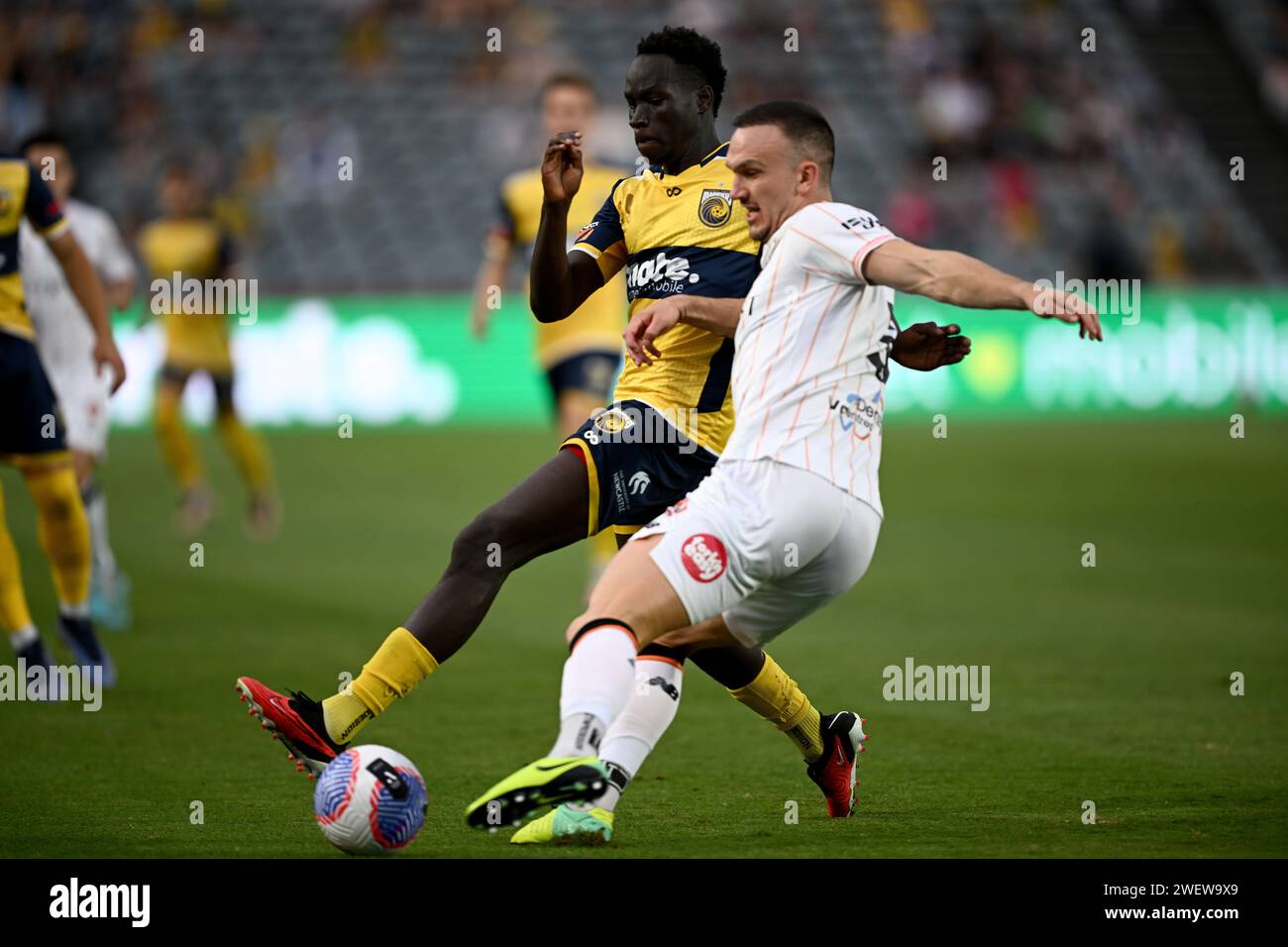 Sydney, Australia. 27th Jan, 2024. Alou Kuol of the Mariners is tackled ...