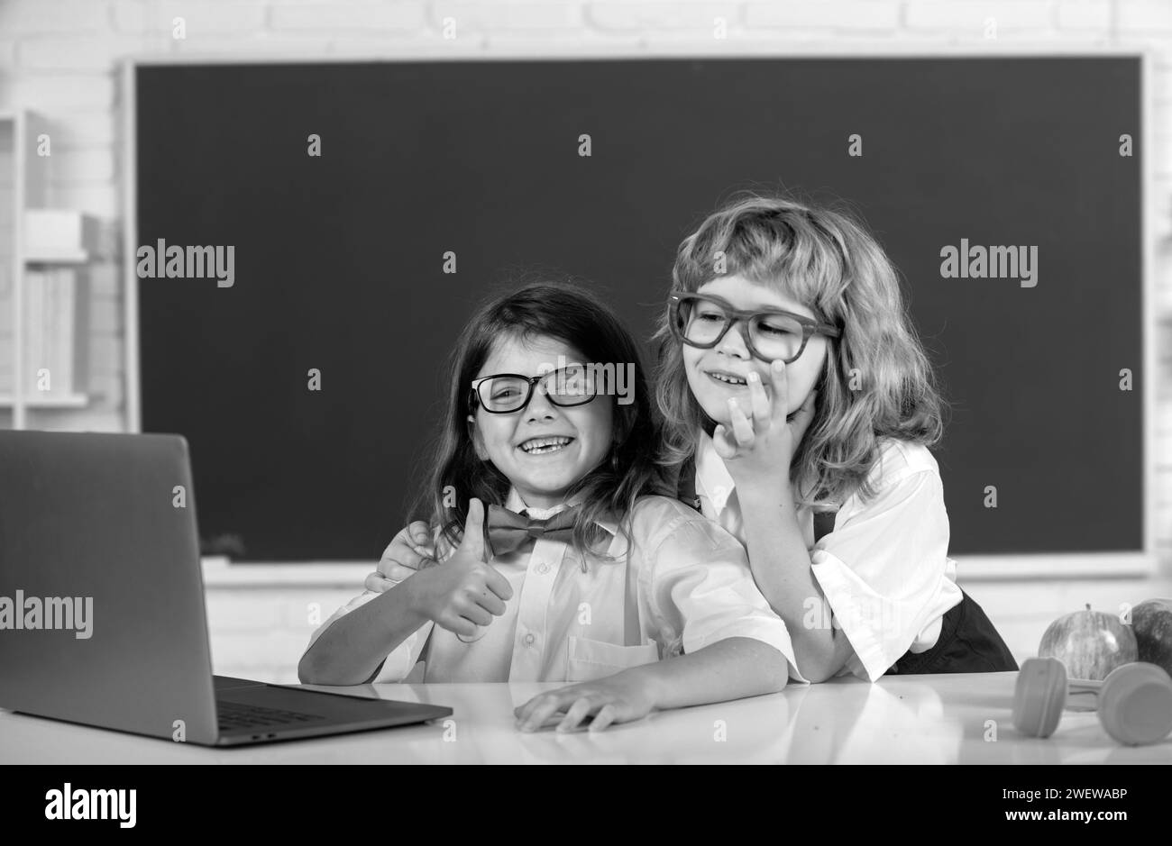 School friends. Friendly classmates in school uniform at lesson. Boy ...