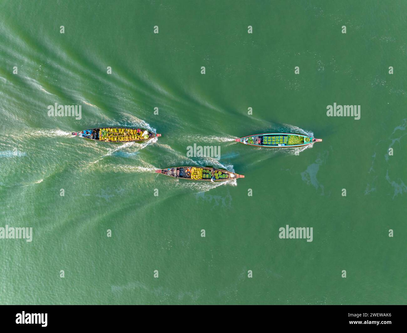 Aerial view of floating market of seasonal fruits on the boats in ...