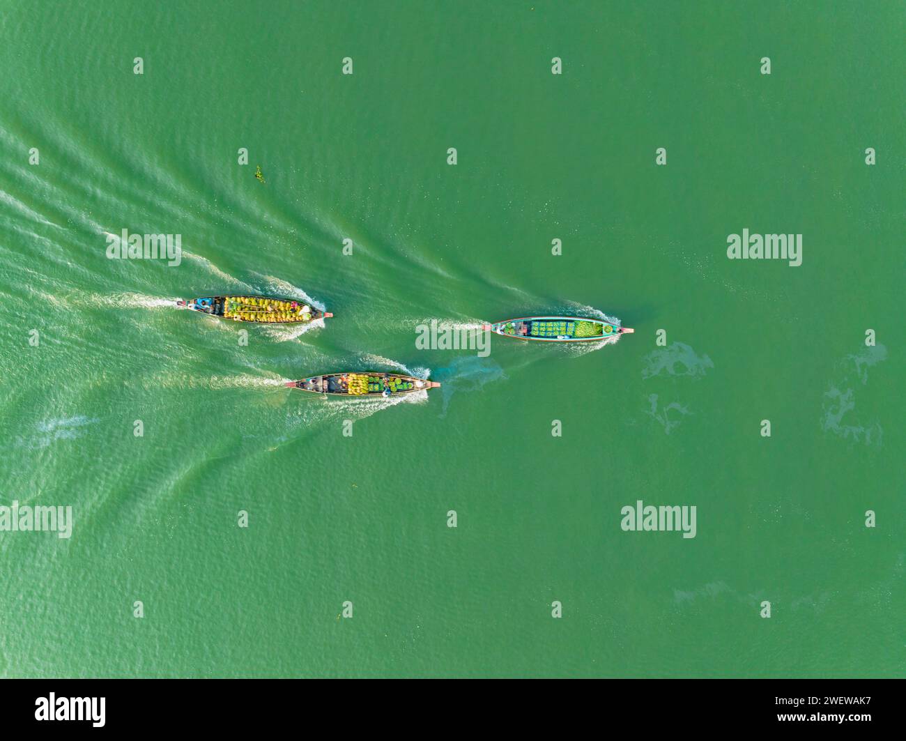 Aerial view of floating market of seasonal fruits on the boats in ...