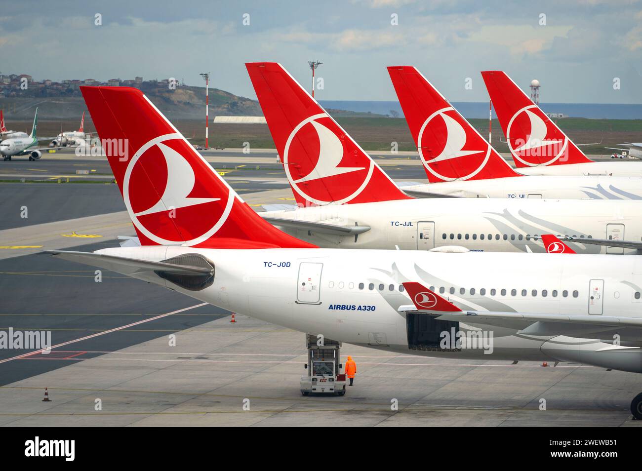 ISTANBUL - JAN 23: Row of planes with Turkish airlines logotype on ...
