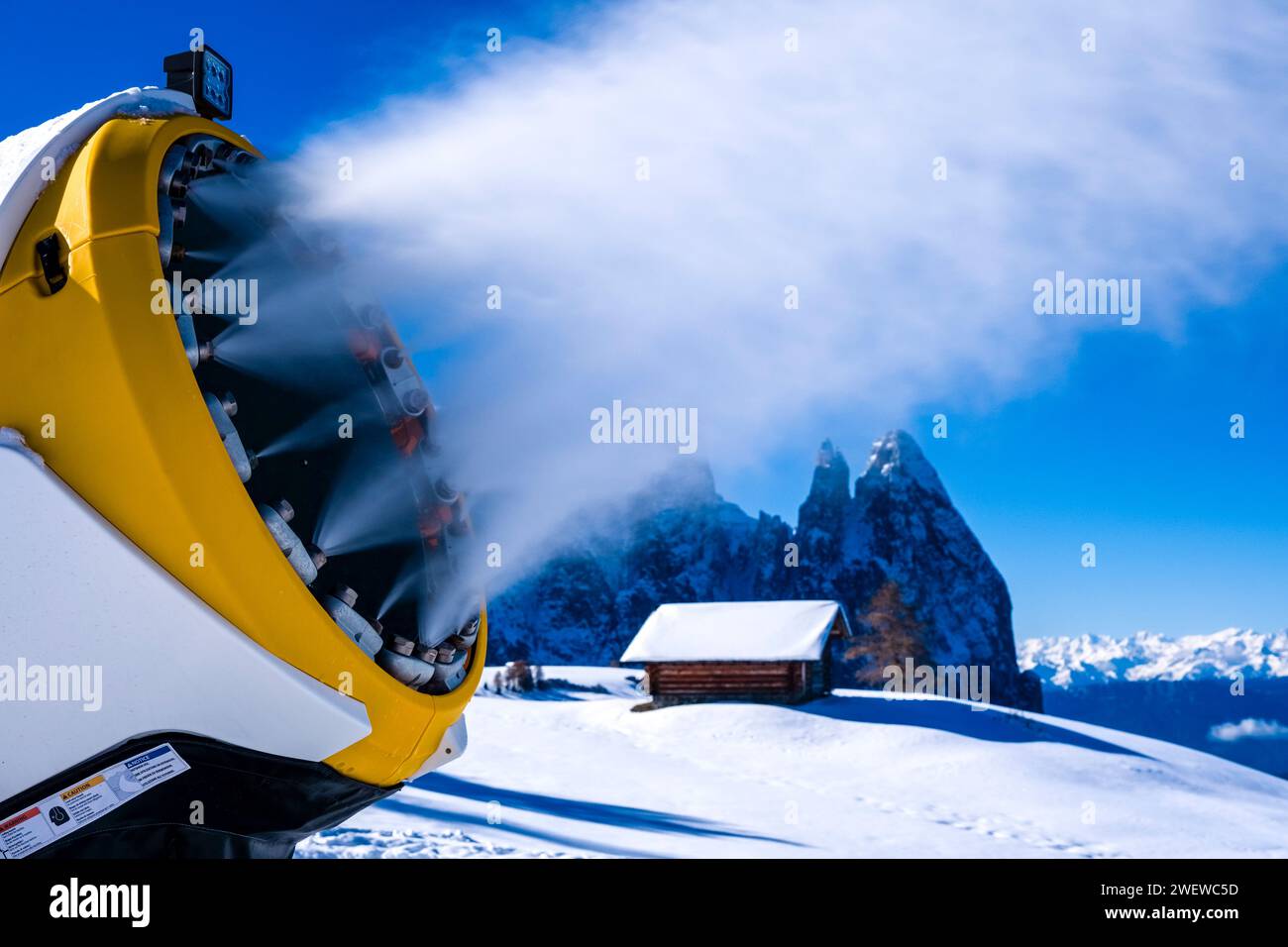 A snow cannon makes snow on the snow-covered mountain pastures of ...