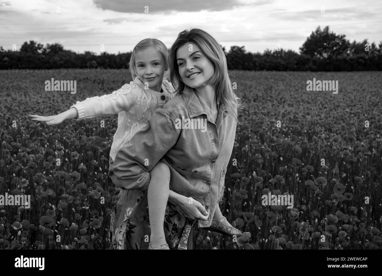 Happy woman in poppy flowers Black and White Stock Photos & Images - Alamy