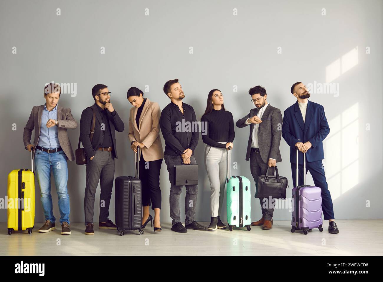 Business people waiting in line at the check-in counters or boarding ...