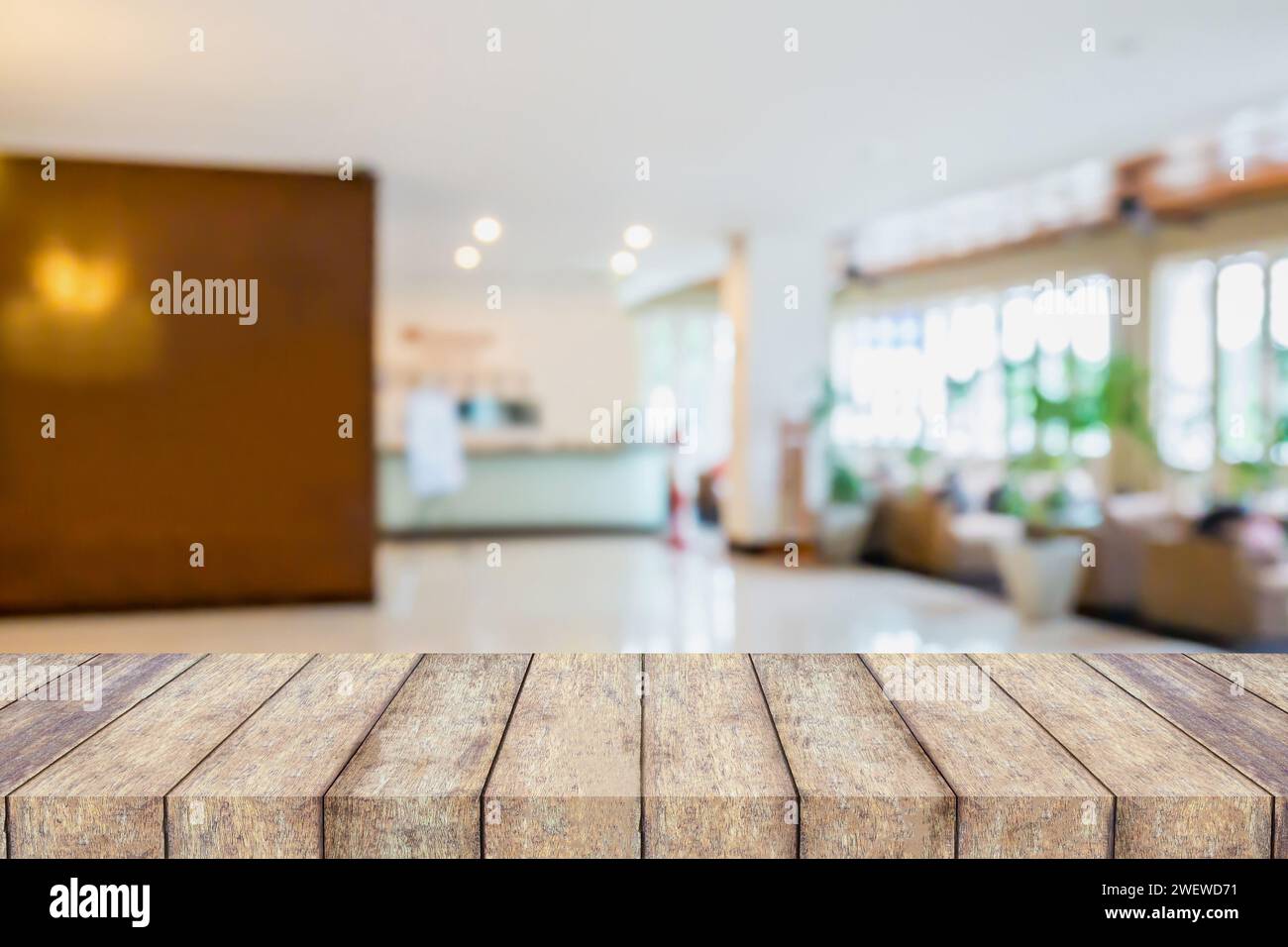 wood table with hotel reception lobby blur background Stock Photo - Alamy
