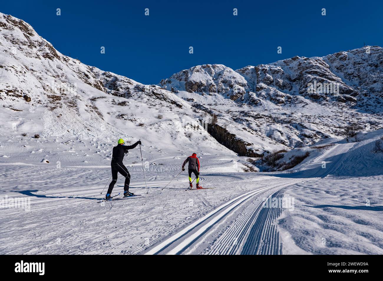 Nordic ski scene in the italian alps Stock Photo - Alamy