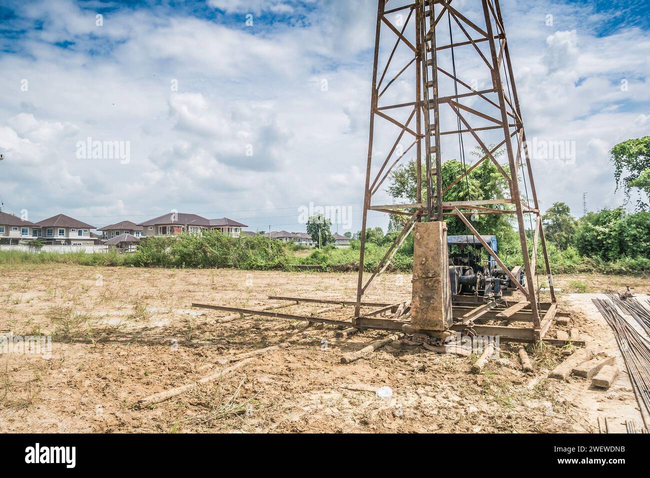 pile driver at house building construction site Stock Photo - Alamy