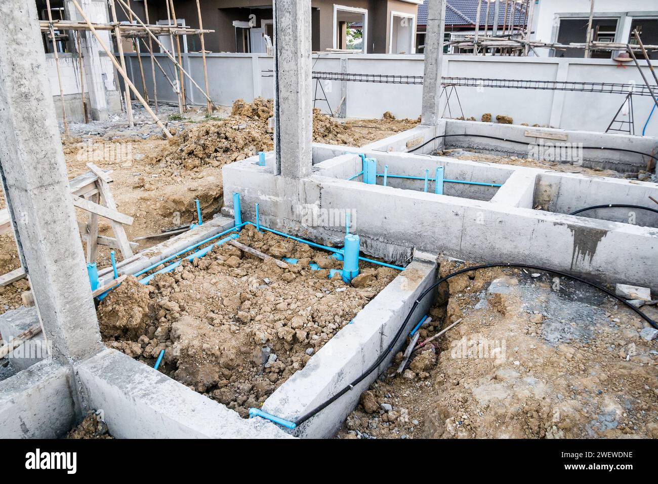 Pest control pipe system install at new house construction foundation ...