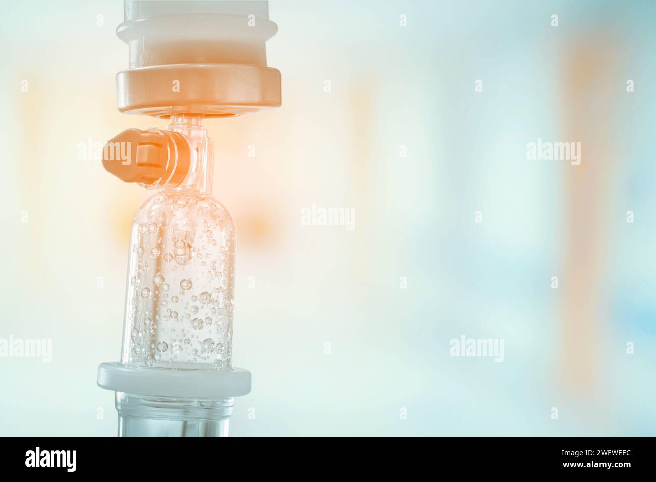 Medical drip with hospital blurred background Stock Photo - Alamy
