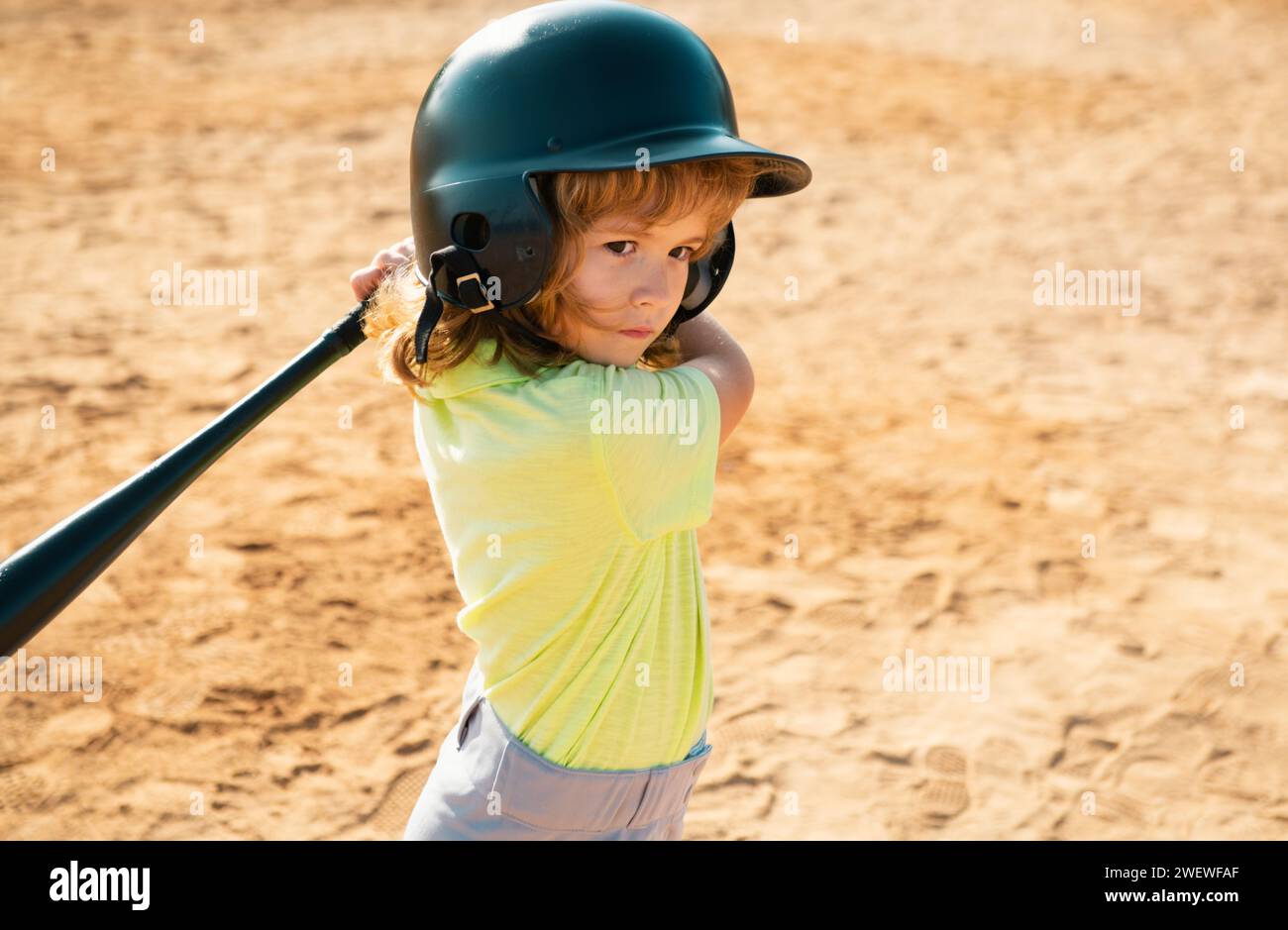 Kid holding a baseball bat. Pitcher child about to throw in youth ...