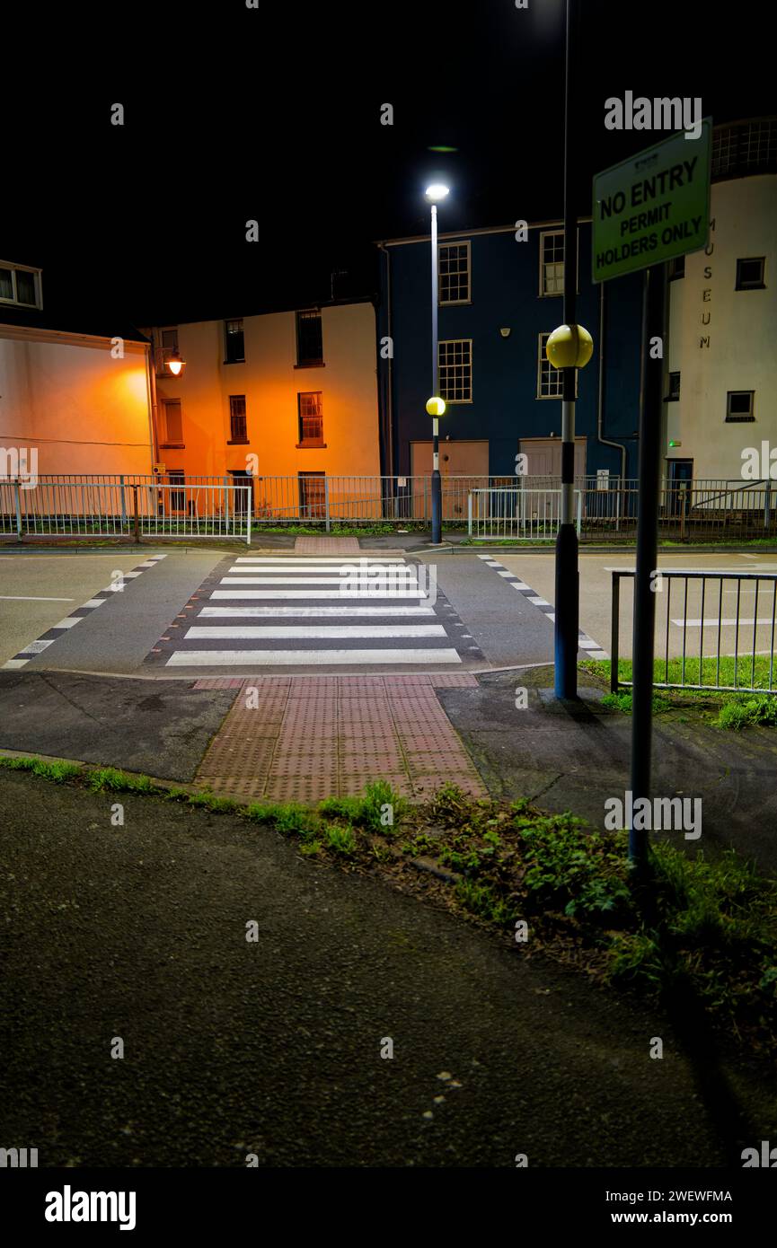 Zebra Crossing at night with Belisha Beacons at each end. No people ...