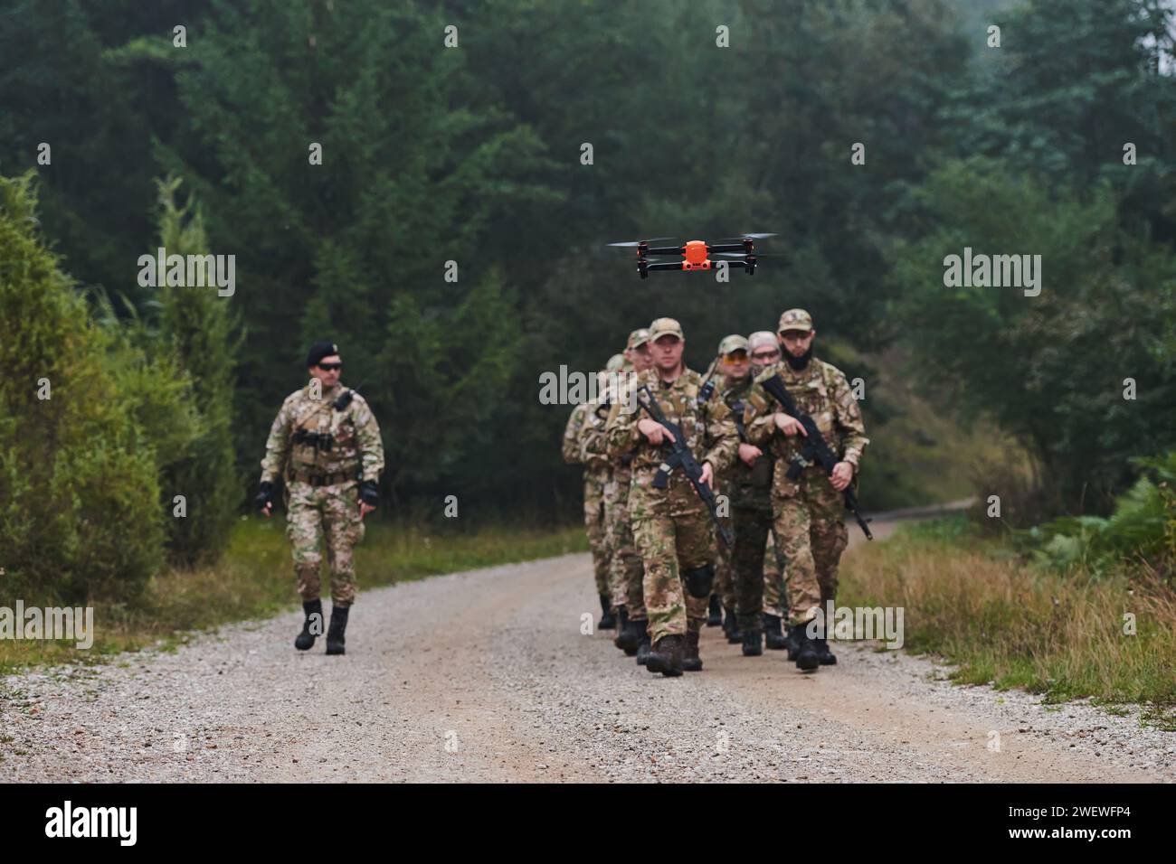 An elite military unit, led by a major, confidently parades through ...