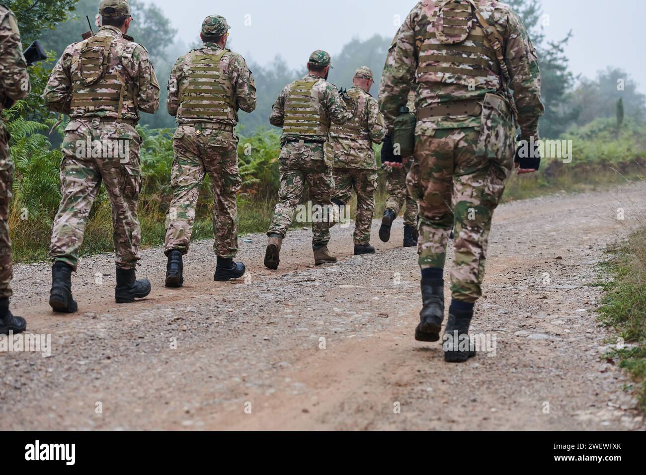 An elite military unit, led by a major, confidently parades through ...