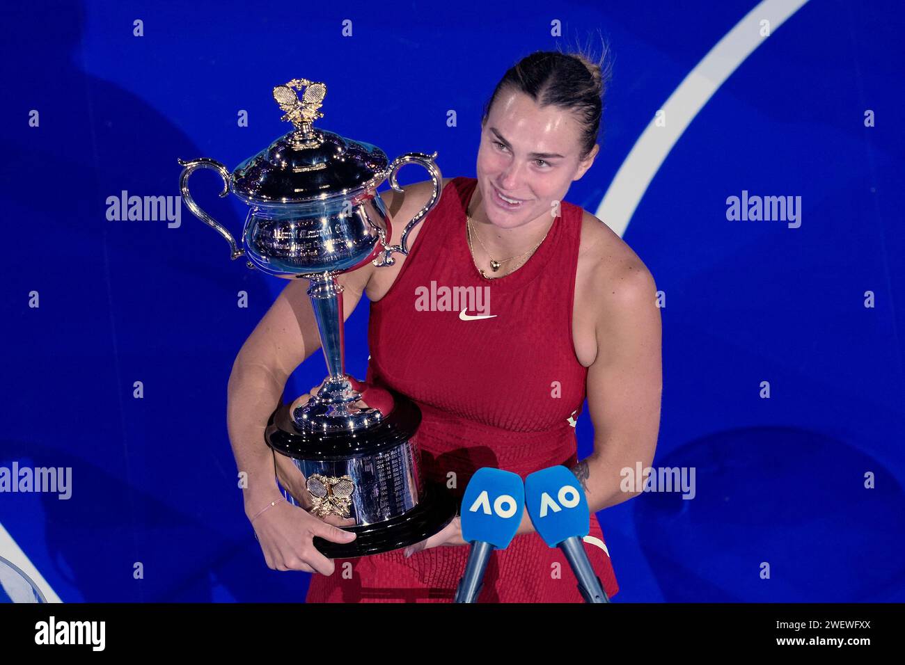 Aryna Sabalenka of Belarus holds the Daphne Akhurst Memorial Cup after defeating Zheng Qinwen of ...
