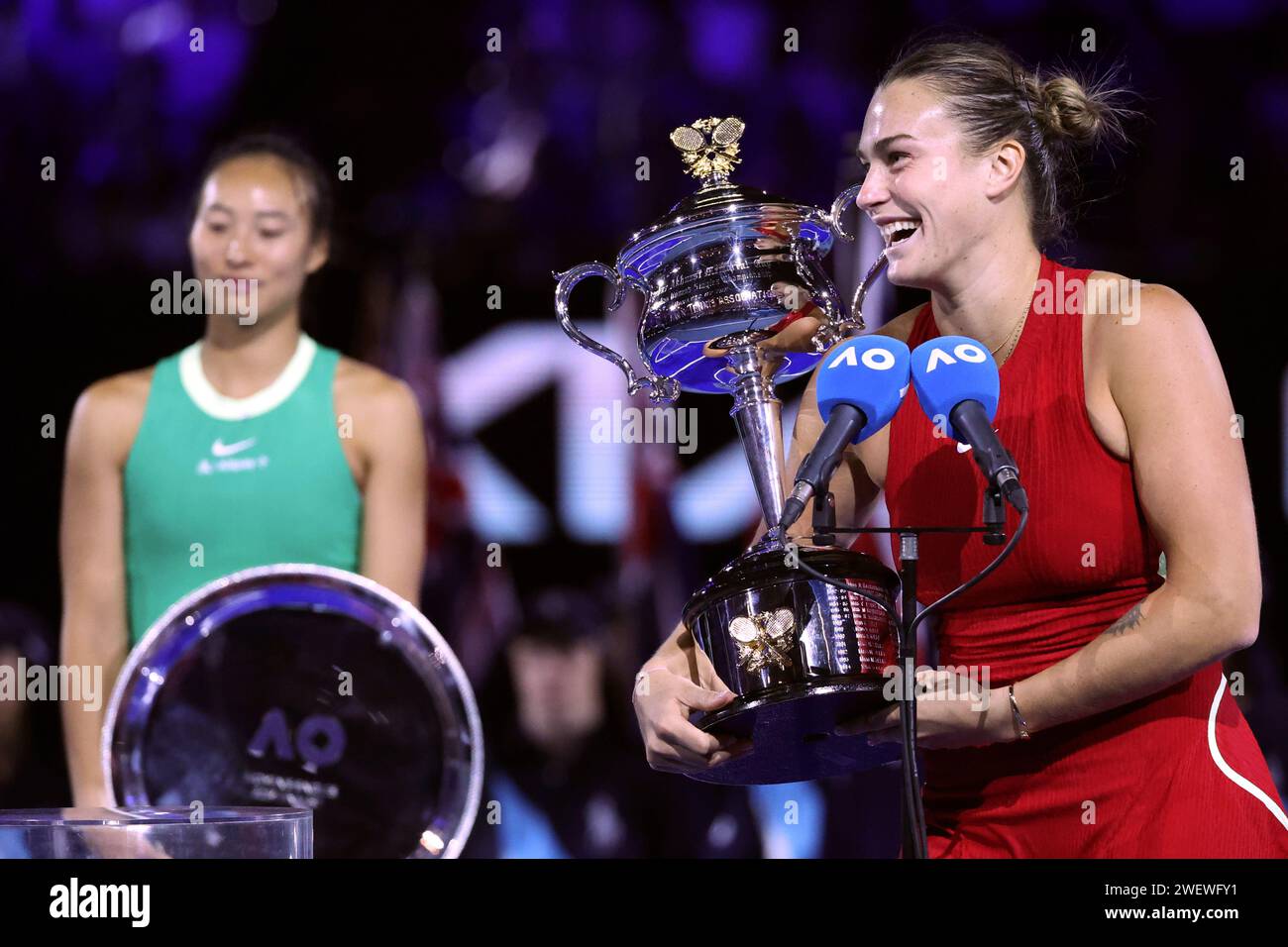 Aryna Sabalenka, right, of Belarus holds the Daphne Akhurst Memorial Cup after defeating Zheng ...
