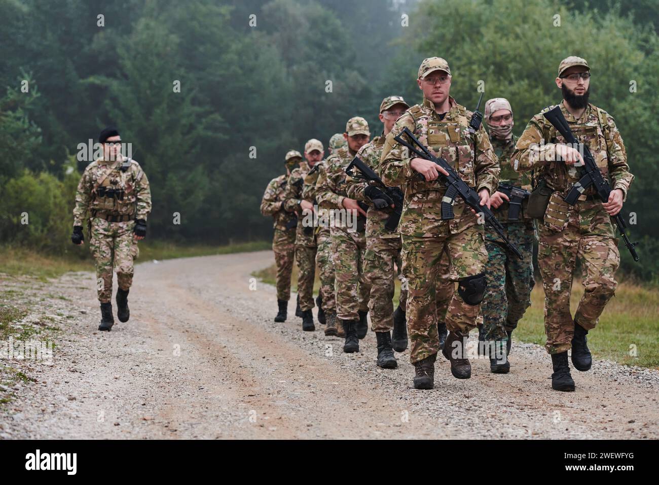 An elite military unit, led by a major, confidently parades through ...